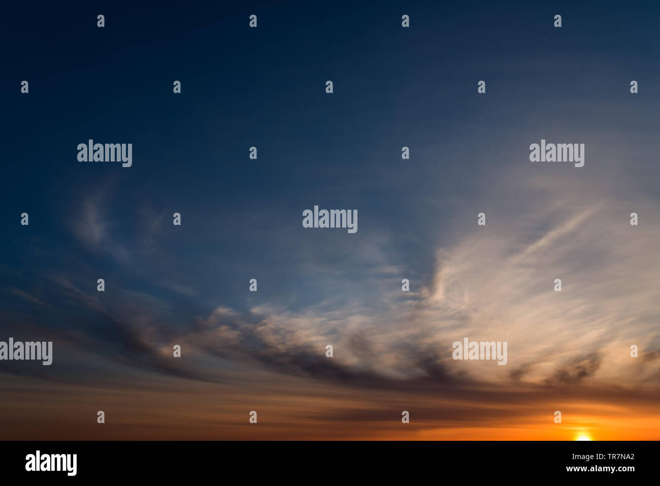 Dramatic sunset sky with orange colored clouds Stock Photo - Alamy
