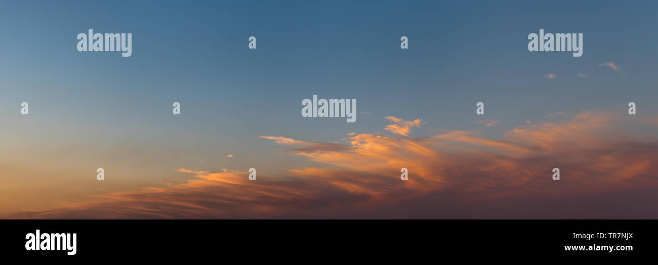 Dramatic sunset sky with orange colored clouds Stock Photo - Alamy