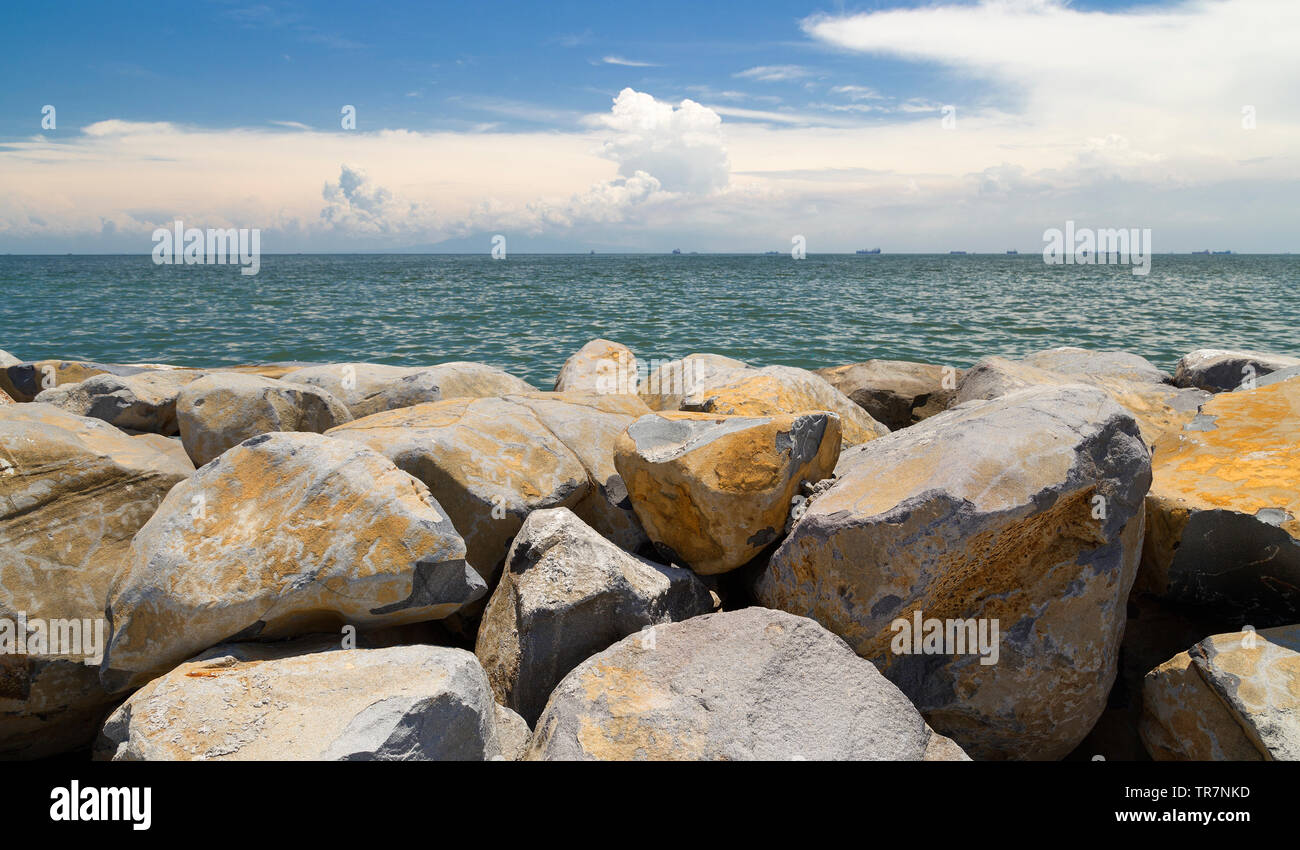 Breakwater stones at the seaside in Manila Bay, Philippines Stock Photo ...