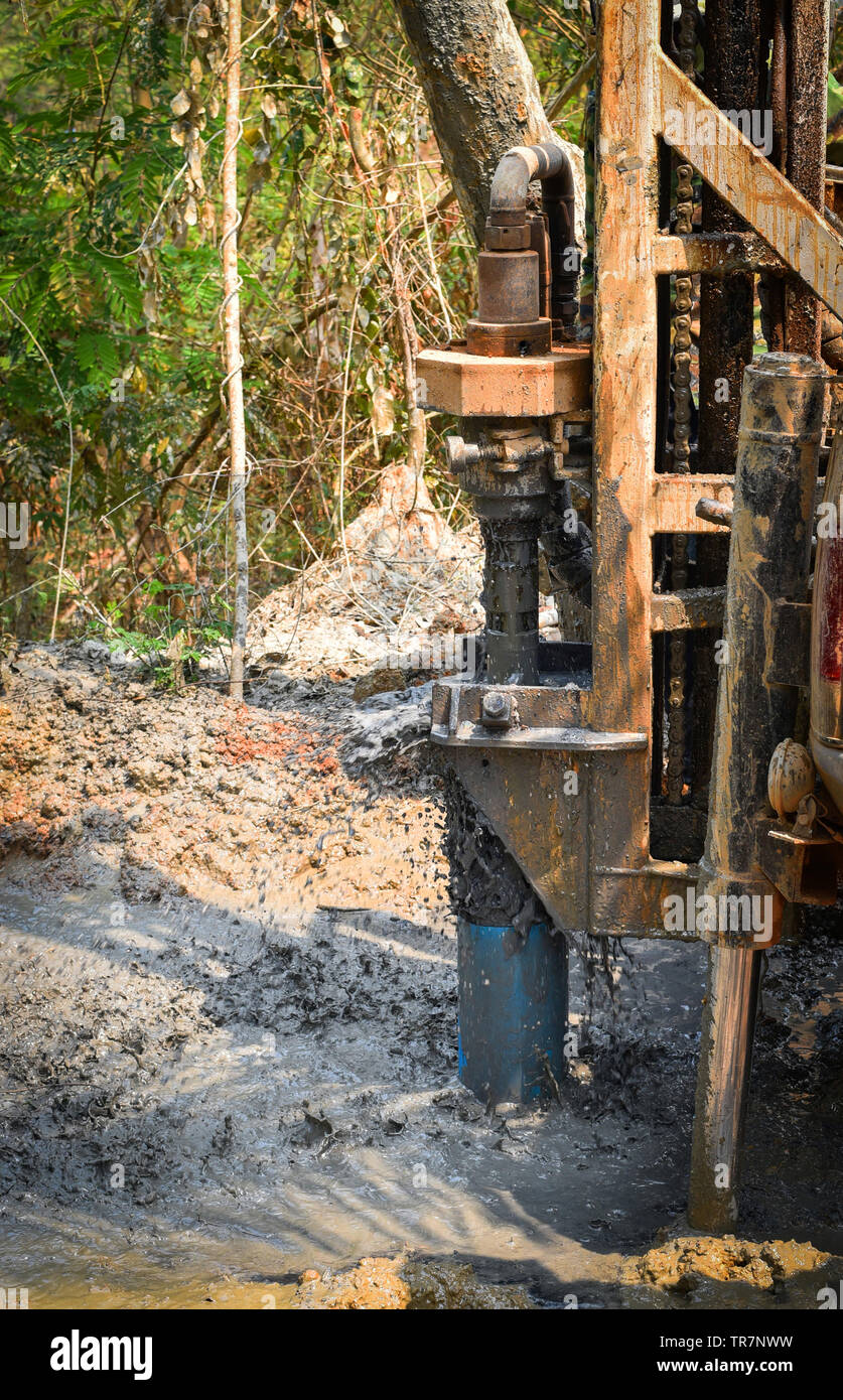 Digging hole drilling groundwater machine installed on deeps ground ...