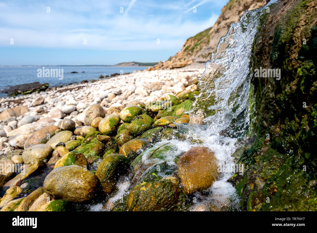 Water outflow on the beach at Osmington Dorset Stock Photo - Alamy