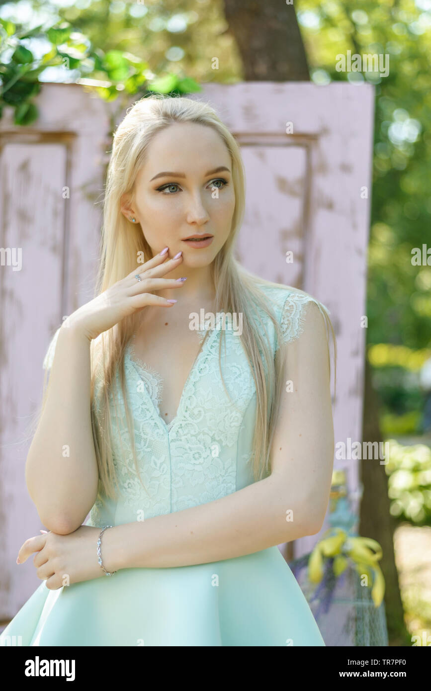 Summertime portrait of young woman in dress Stock Photo - Alamy
