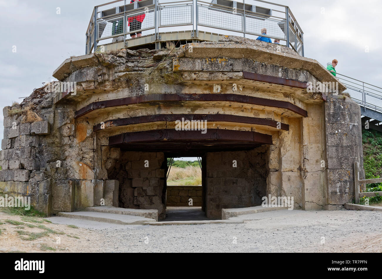 old stone bunker, Pointe du Hoc; WWII German cliffside defense; people ...