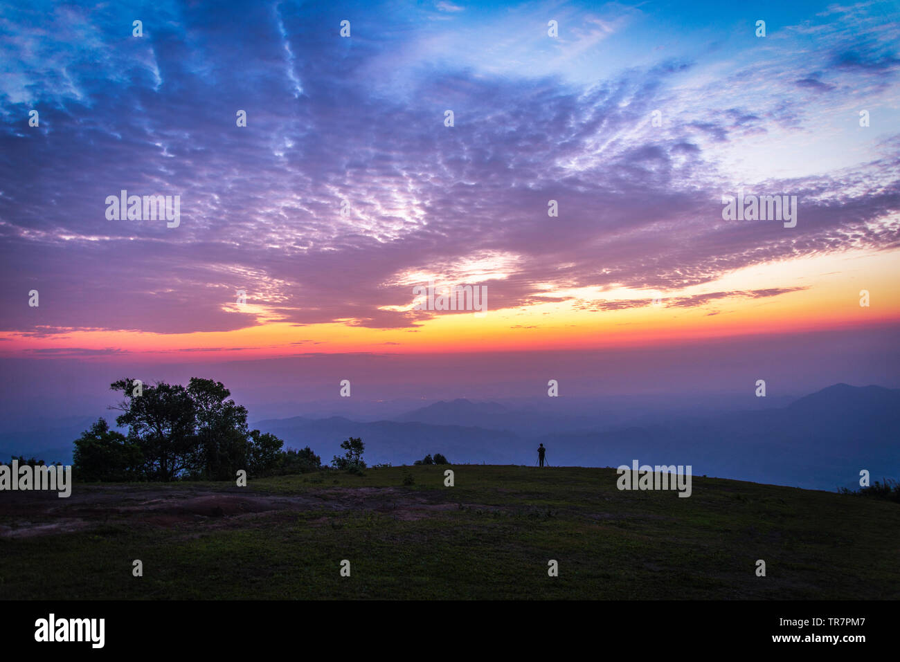 Man on top hill beautiful sky sunset or sunrise with clouds dramatic ...