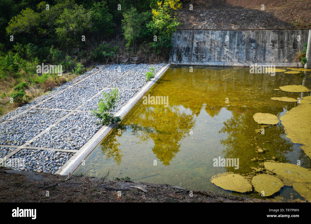 Drainage dam reservoir on hill with canal and drainage system water ...