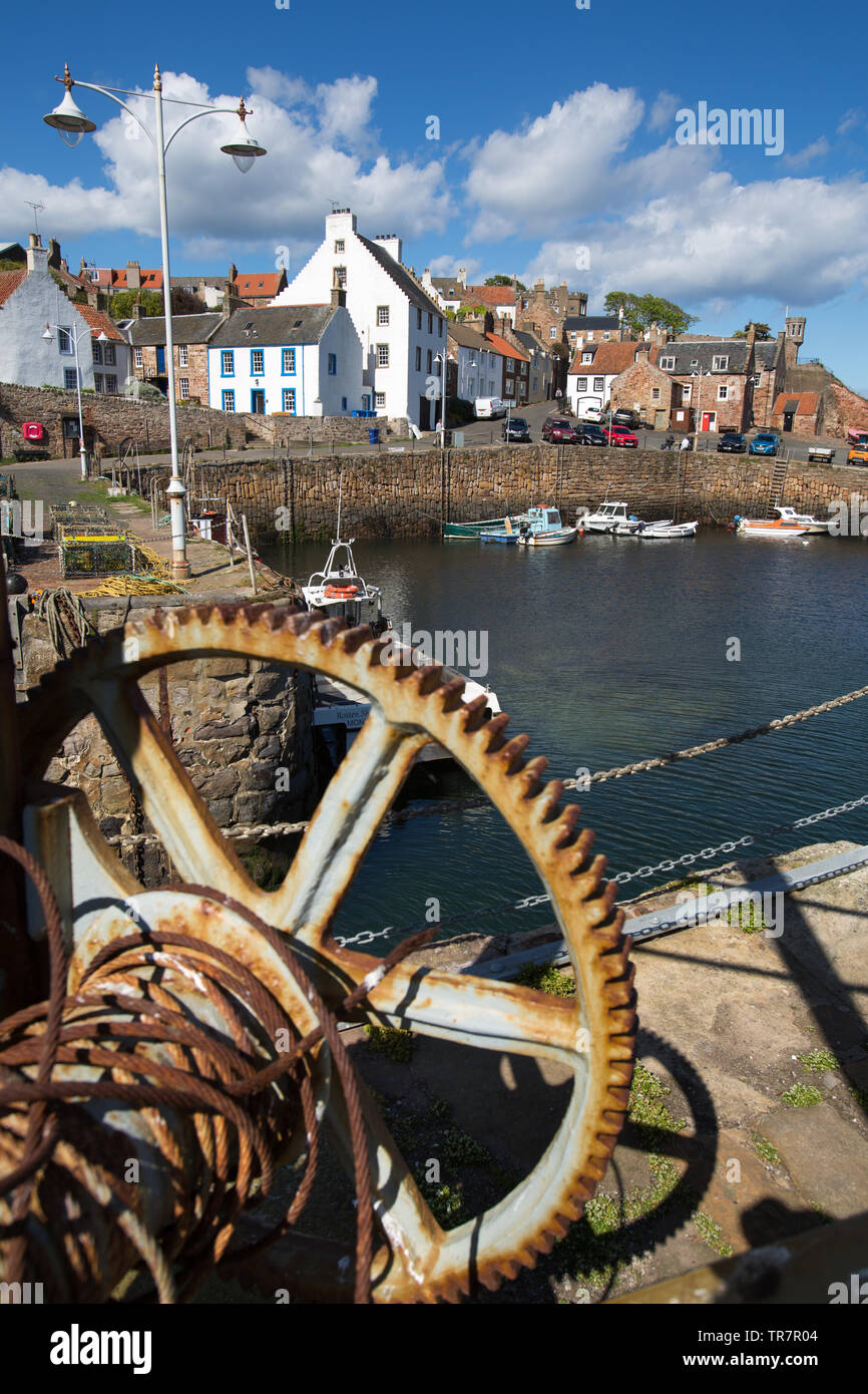 Town of Crail, Scotland. Picturesque sunny view of rusted lifting gear ...