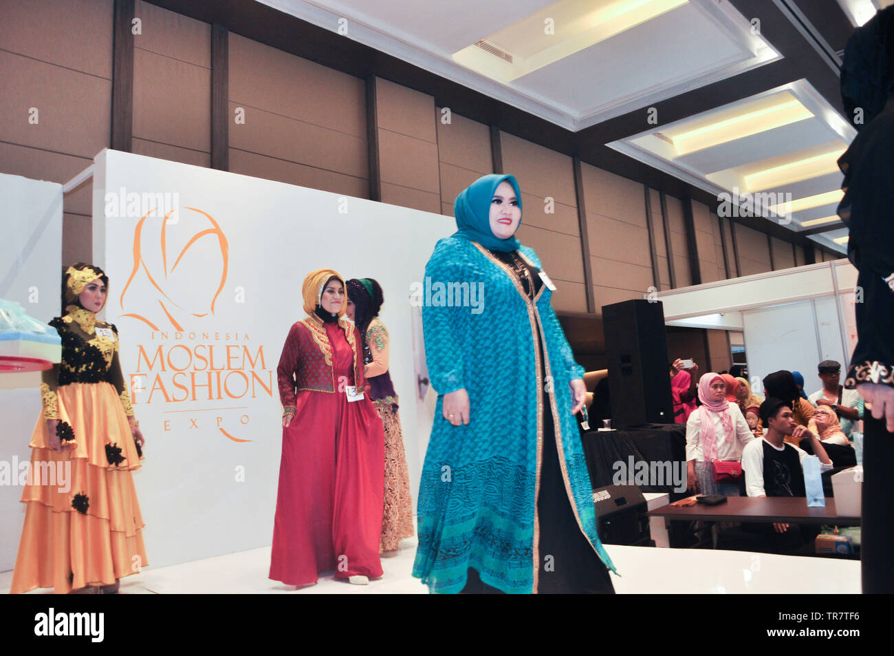 Indonesian muslim women walk on the catwalk during a fashion ...