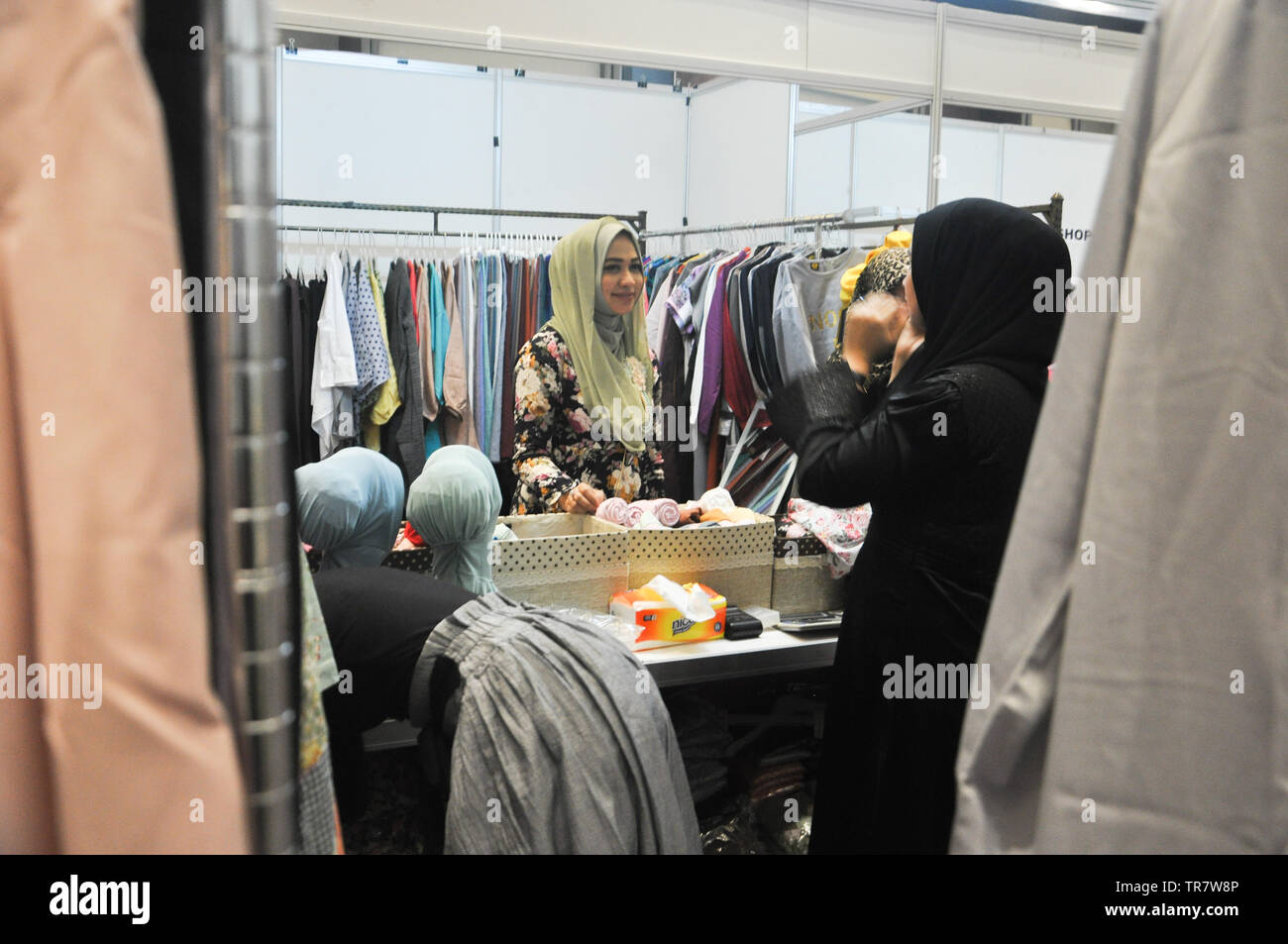 An Indonesian muslim woman visits a booth at Indonesia Moslem Fashion ...