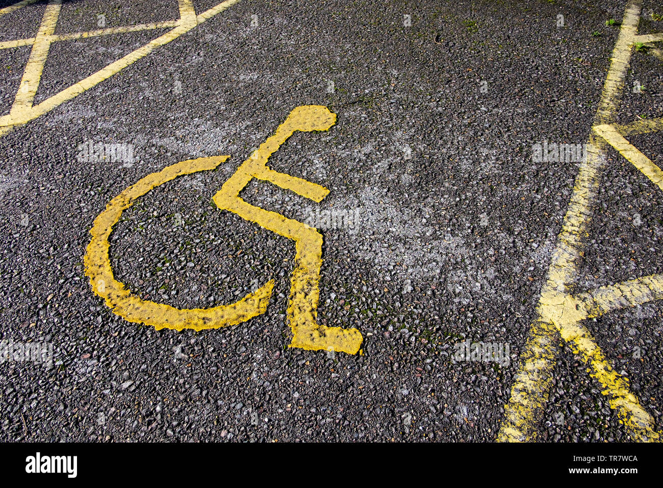 Disabled parking space in road Stock Photo - Alamy