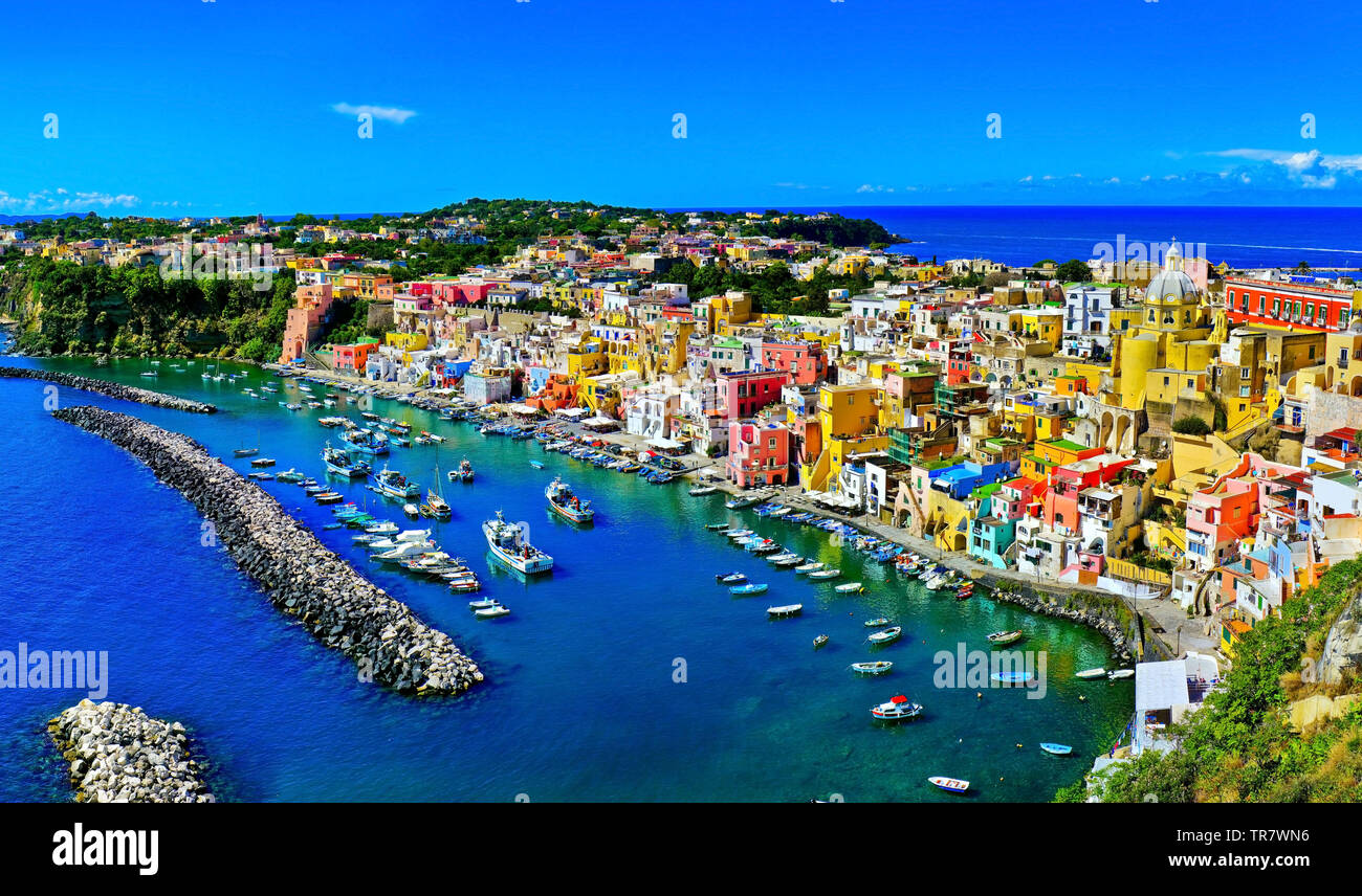 View of the Port of Corricella with lots of colorful houses on a sunny ...