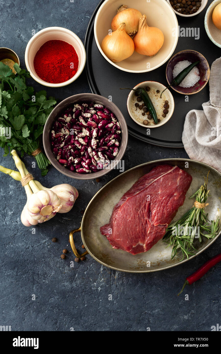 Raw ingredients for cooking healthy food. Raw beef meat with herbs ...