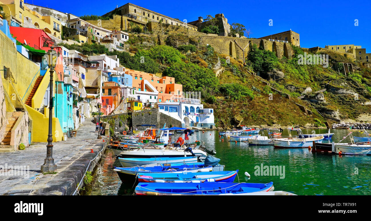 View of the colorful houses at the Port of Corricella in Procida Island ...