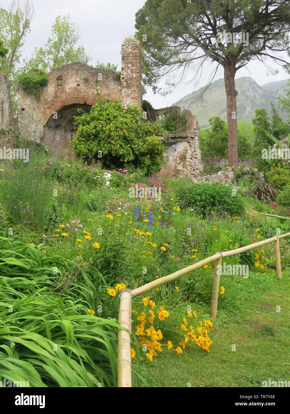 Lush English planting and the ruins of an Italian medieval town create ...