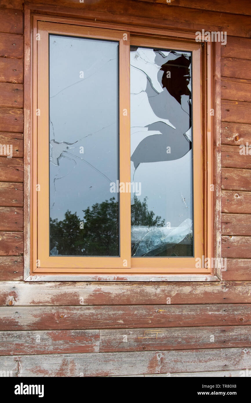 Close up view of cracked and broken glass window. Vandalism fracture ...