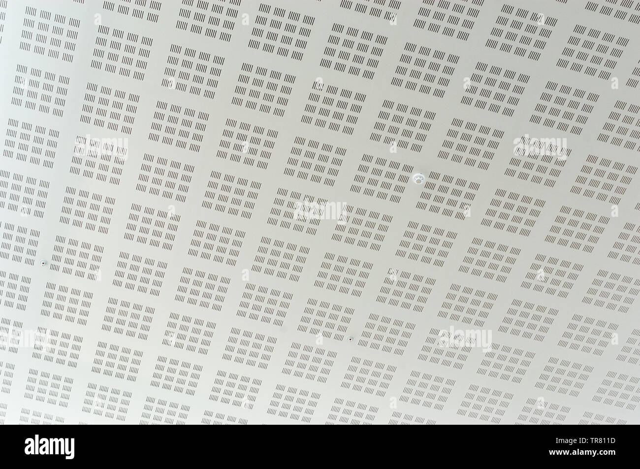 Pattern of holes in a white ceiling Stock Photo - Alamy
