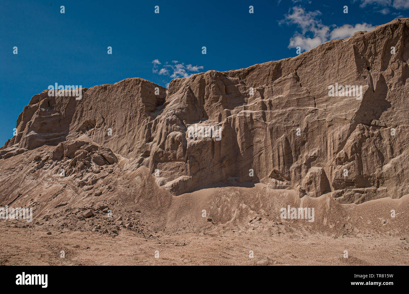 A big pile of fine grain sand creating a cliffside Stock Photo - Alamy