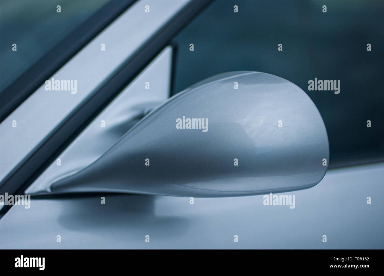 Grey, polished, left side car mirror Stock Photo - Alamy