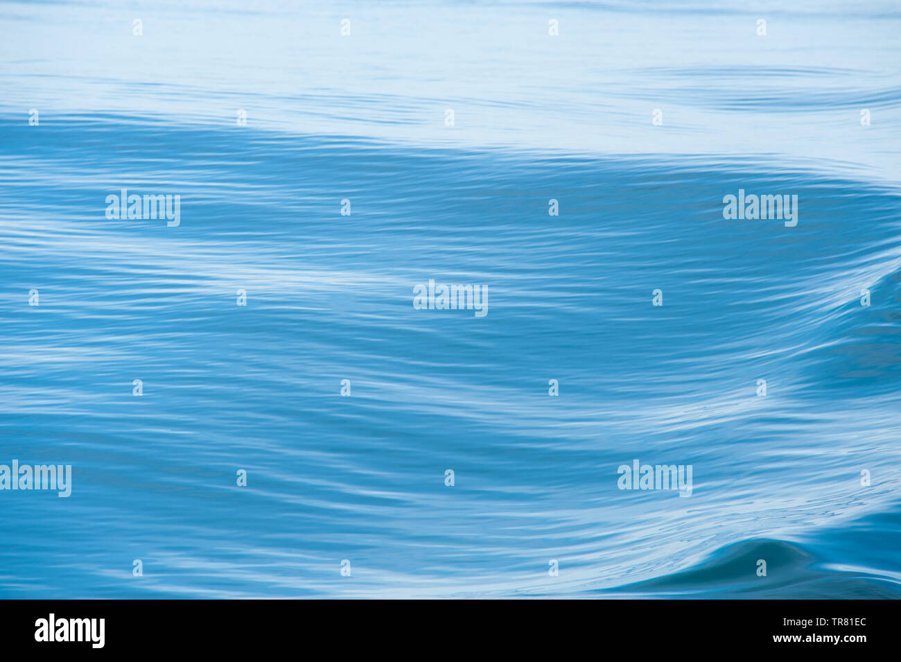 Blue, open sea tiny waves, ripples Stock Photo - Alamy