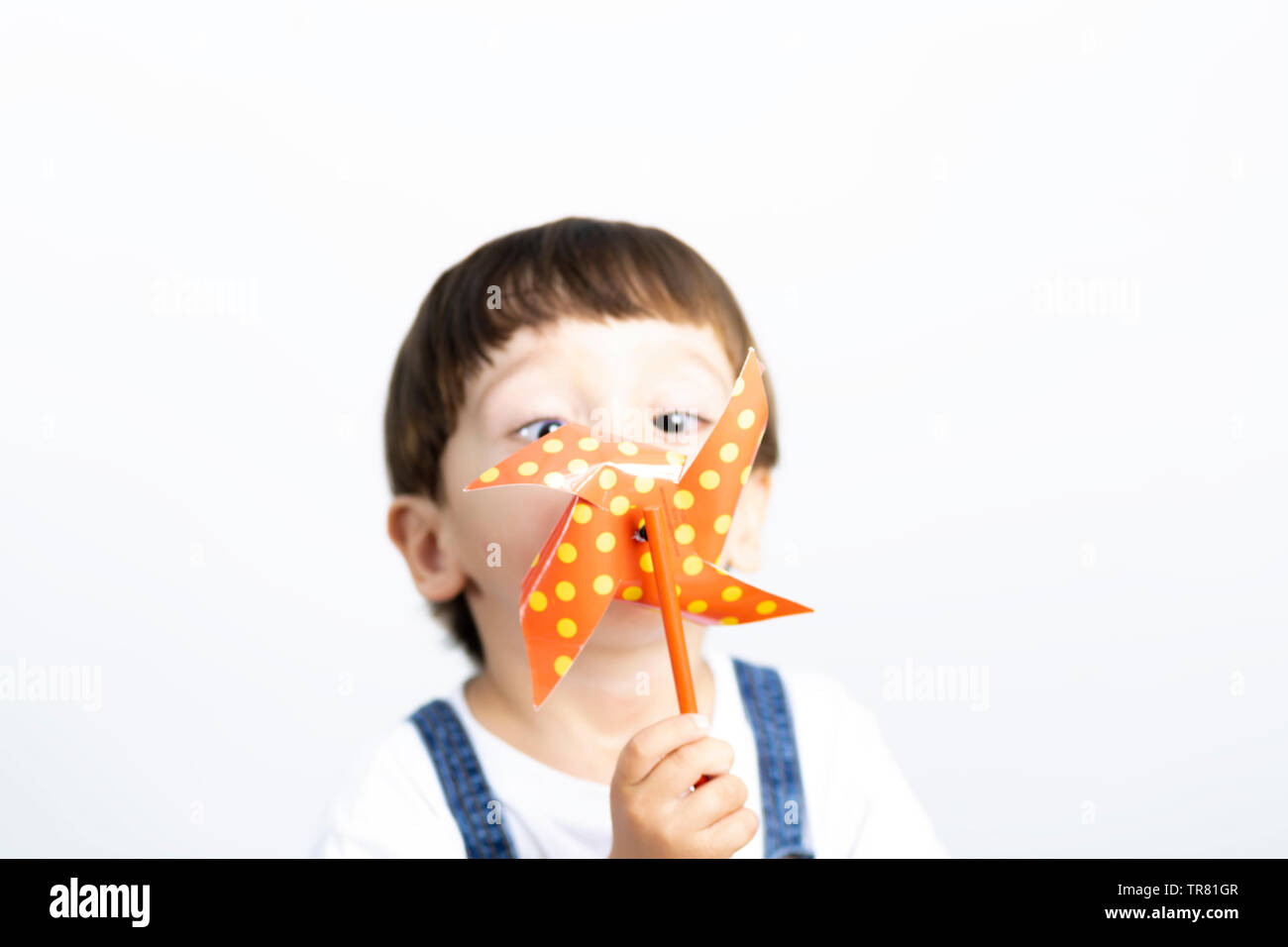 Little Happy Boy Playing with Pinwheel, Wind Play Stock Photo - Alamy
