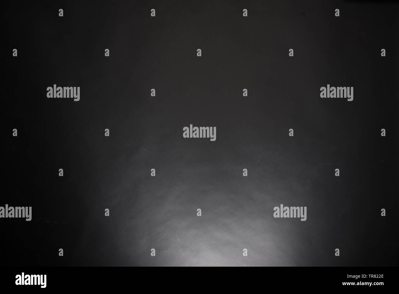 black background paper lit by a single light Stock Photo - Alamy