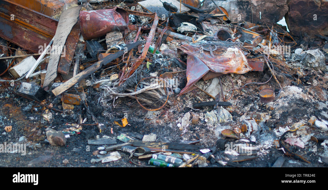 A pile of rusty, burnt metal scrap Stock Photo - Alamy