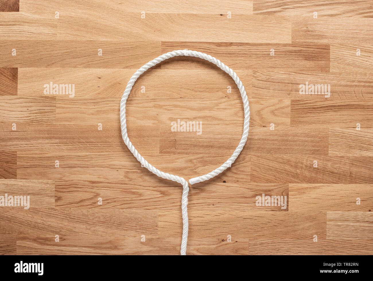 The letter O formed with white rope on a wooden table Stock Photo - Alamy