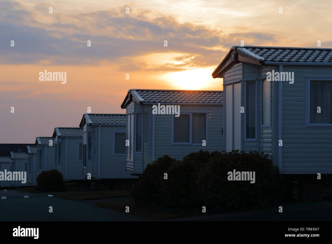 Beautiful sunset over a holiday park Stock Photo - Alamy