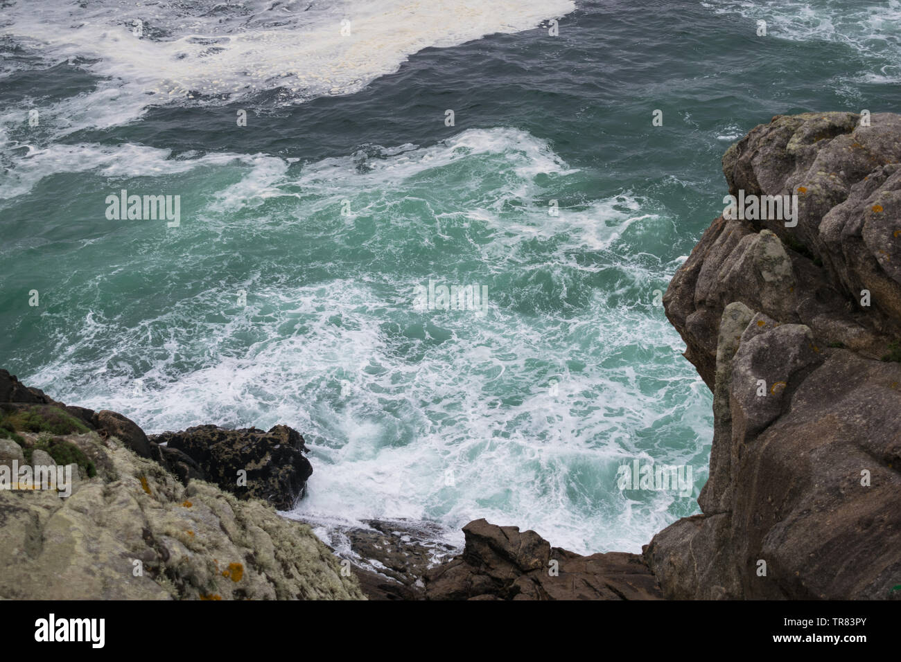 Top view of waves of the Atlantic sea hitting rocks on a cliff Stock ...