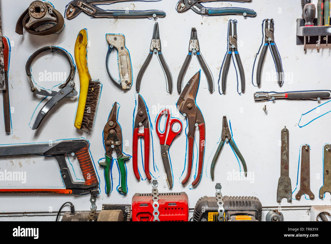 Tools systematically arranged on a wall Stock Photo - Alamy