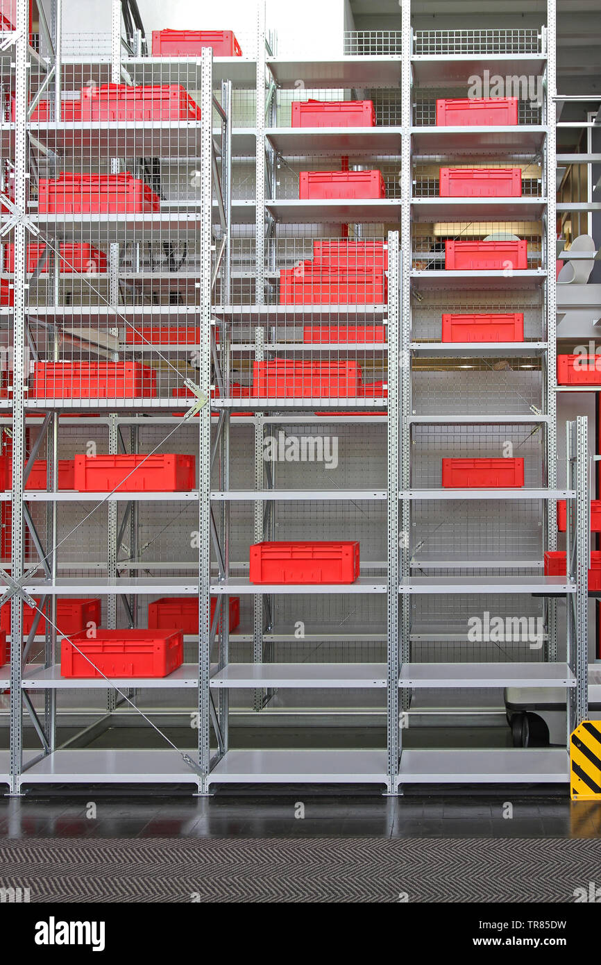 Red Crates and Boxes at Shelf in Distribution Warehouse Stock Photo - Alamy