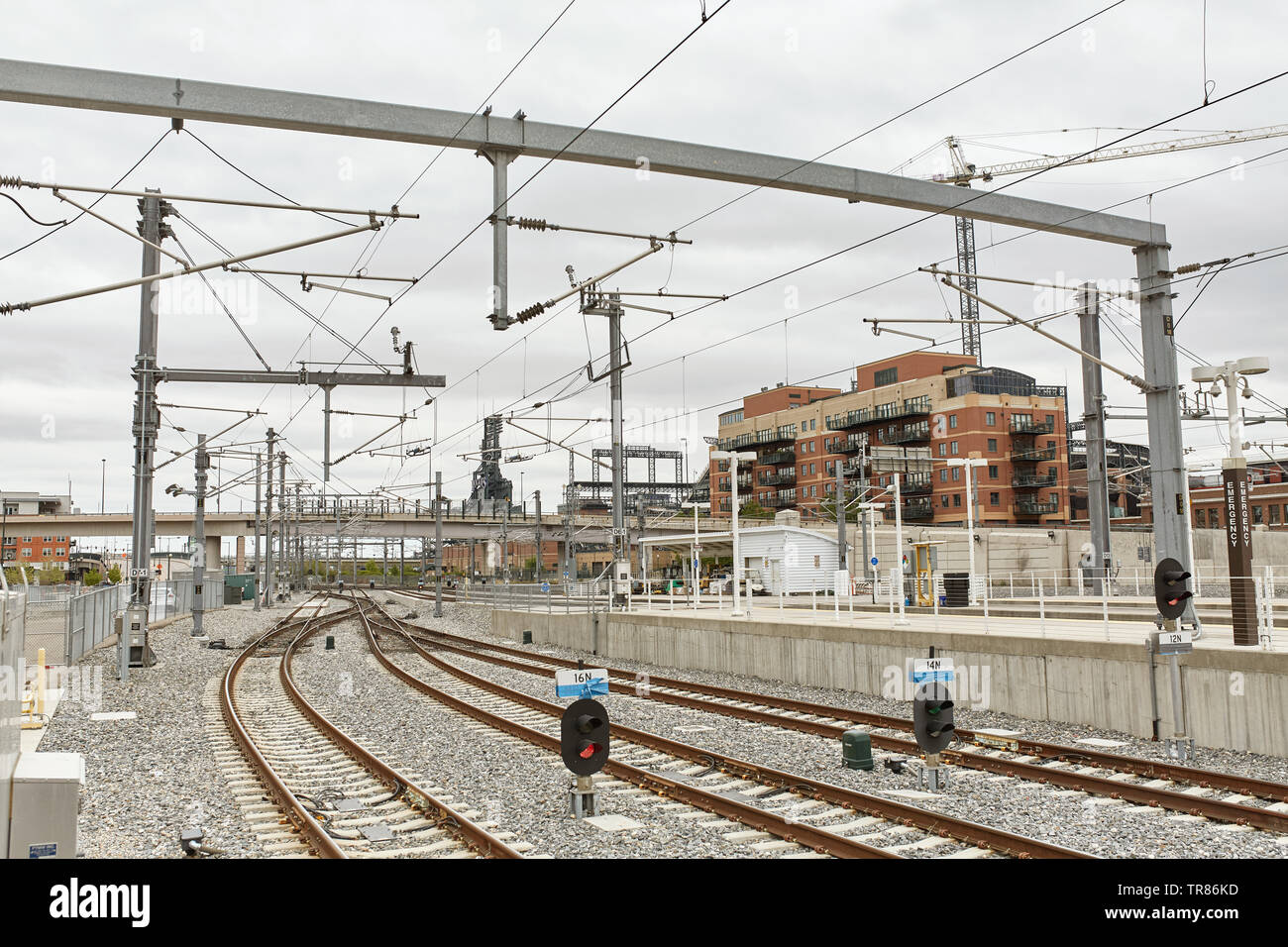 Condominiums and highrise buildings behind train tracks, downtown at ...
