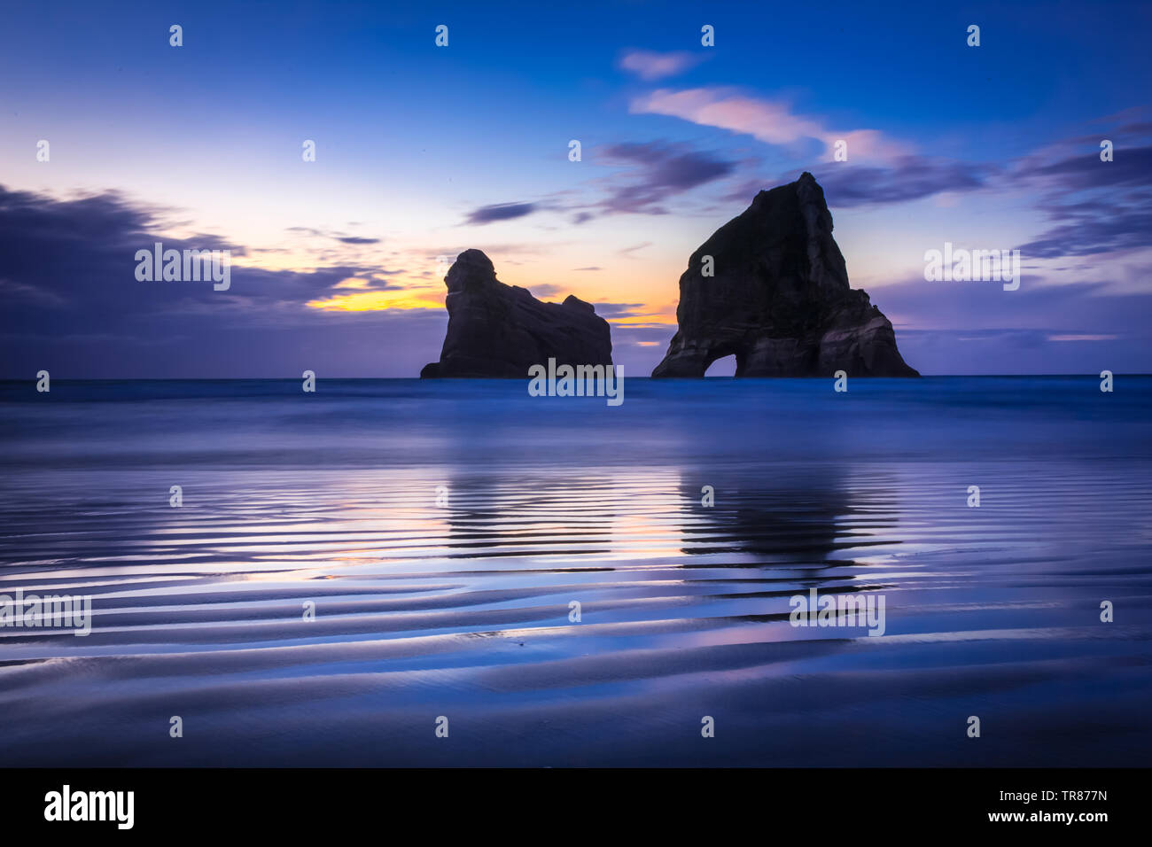 Wharariki Beach at sunset, South Island, New Zealand Stock Photo - Alamy