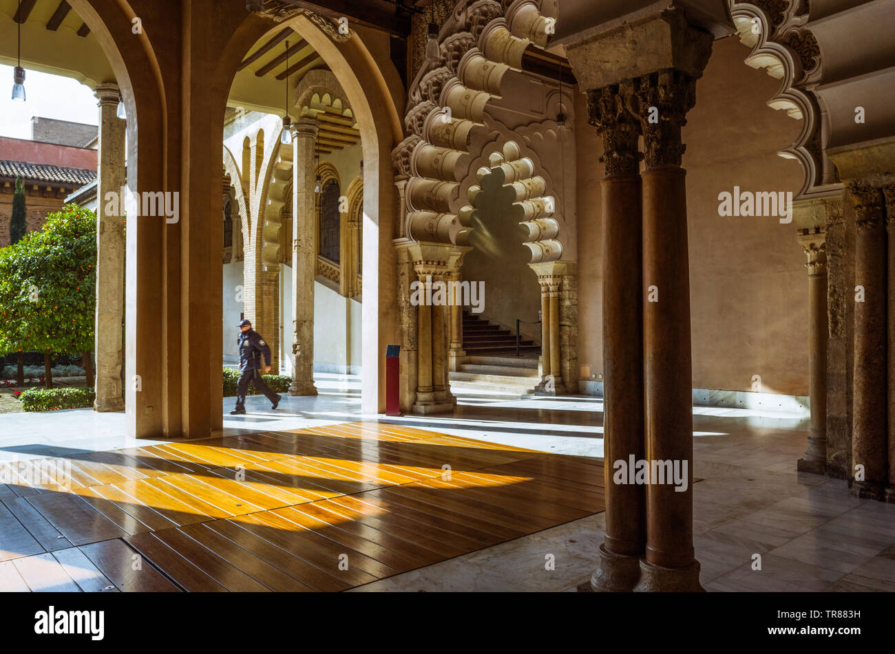Zaragoza, Aragon, Spain : A man walks past the Moorish portico of the ...