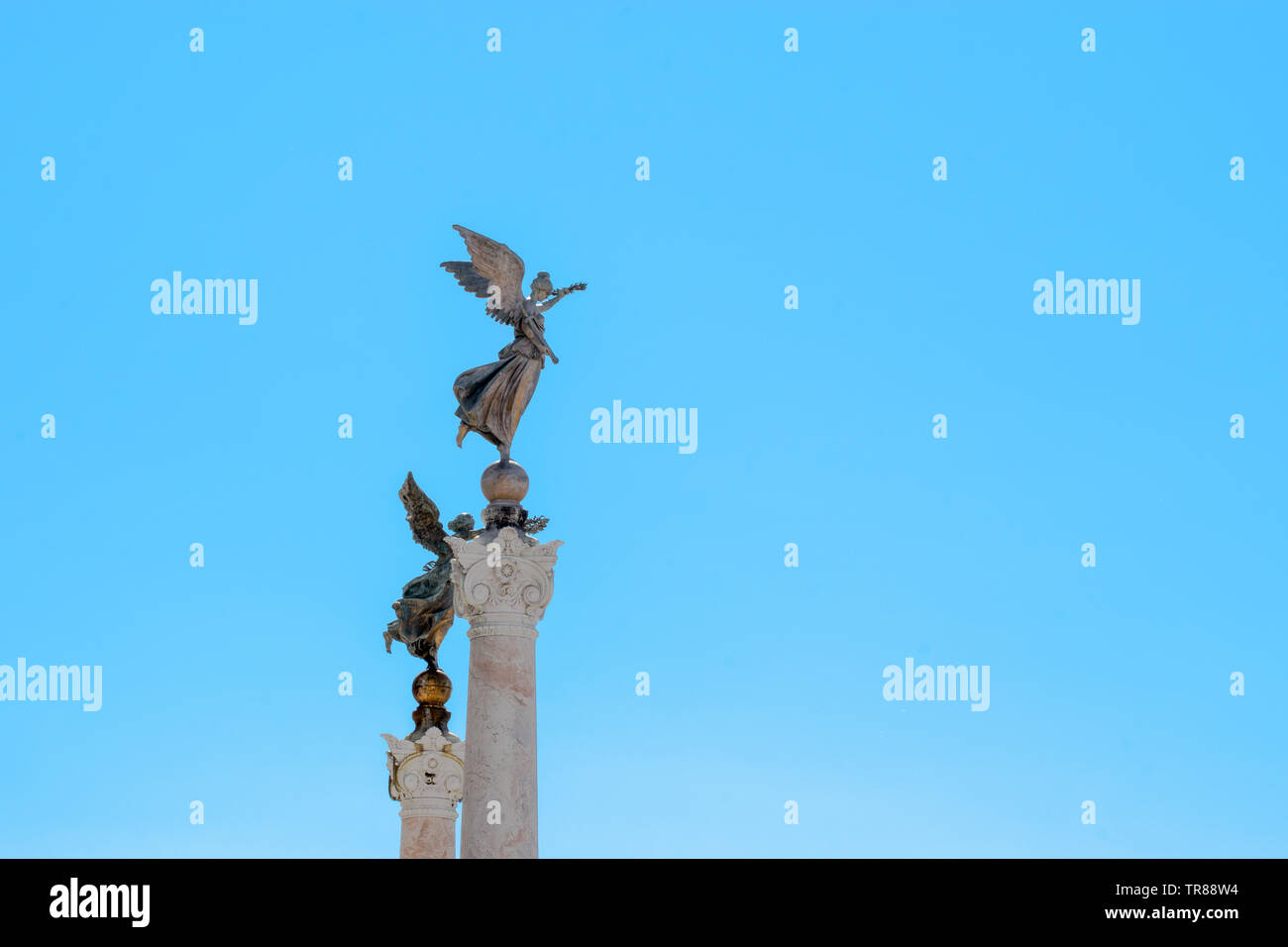 Winged woman statues in front of Altare della Patria, Piazza Venezia ...