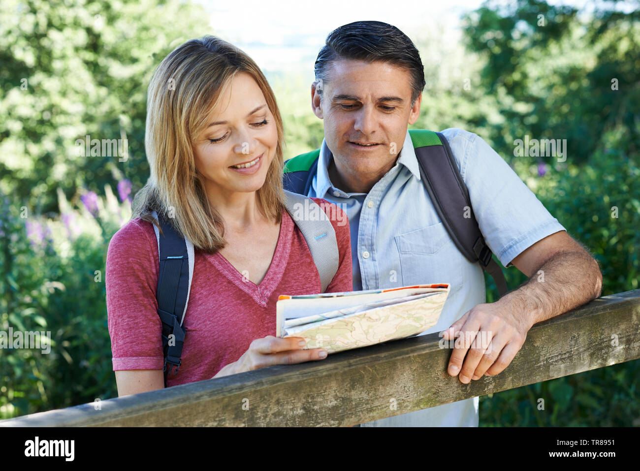 Happy middle aged couple map in hi-res stock photography and images - Alamy