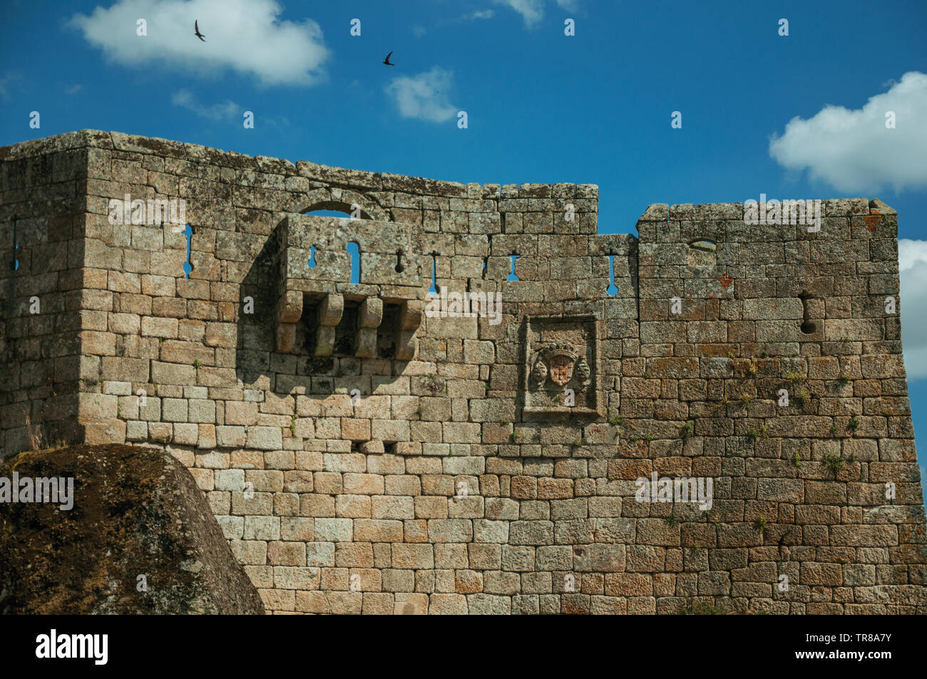 Balcony in gothic style on a wall made of stone bricks at the Sortelha ...