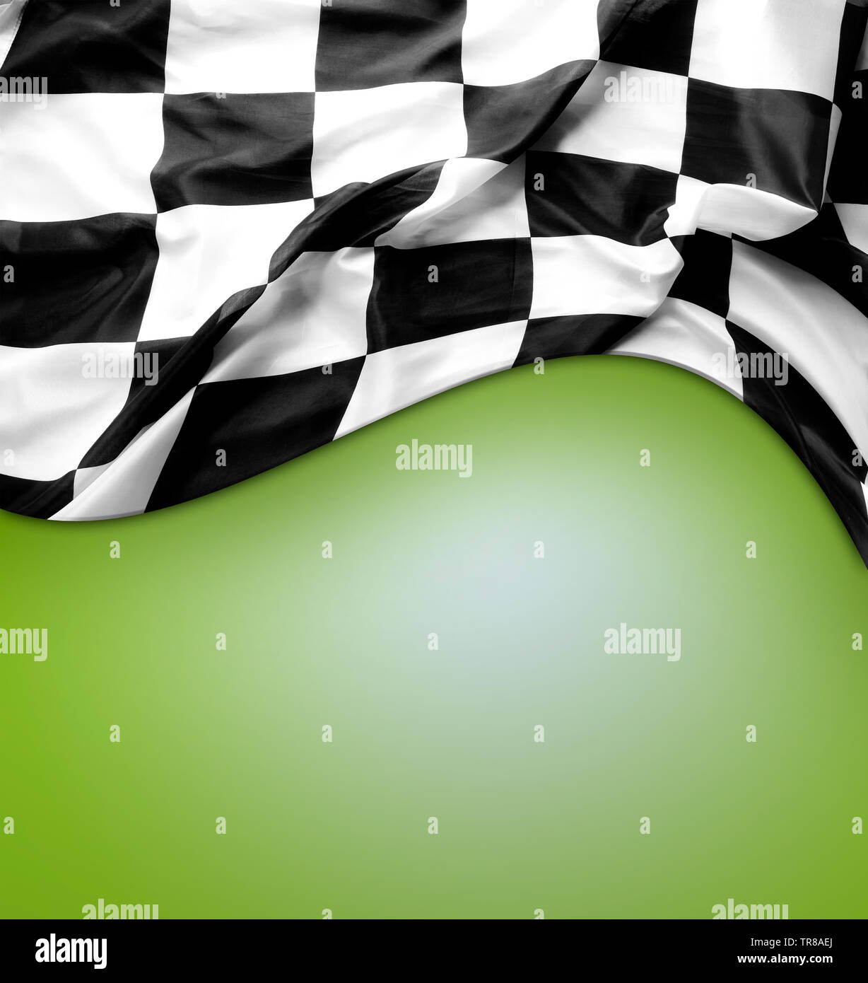 Checkered black and white flag on green background Stock Photo - Alamy