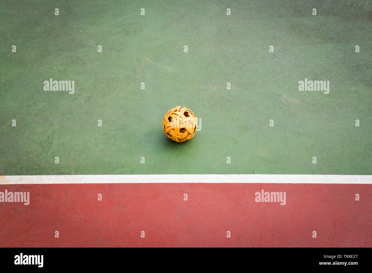 Sepak Takraw ball or rattan ball on field of sepak takraw court with ...