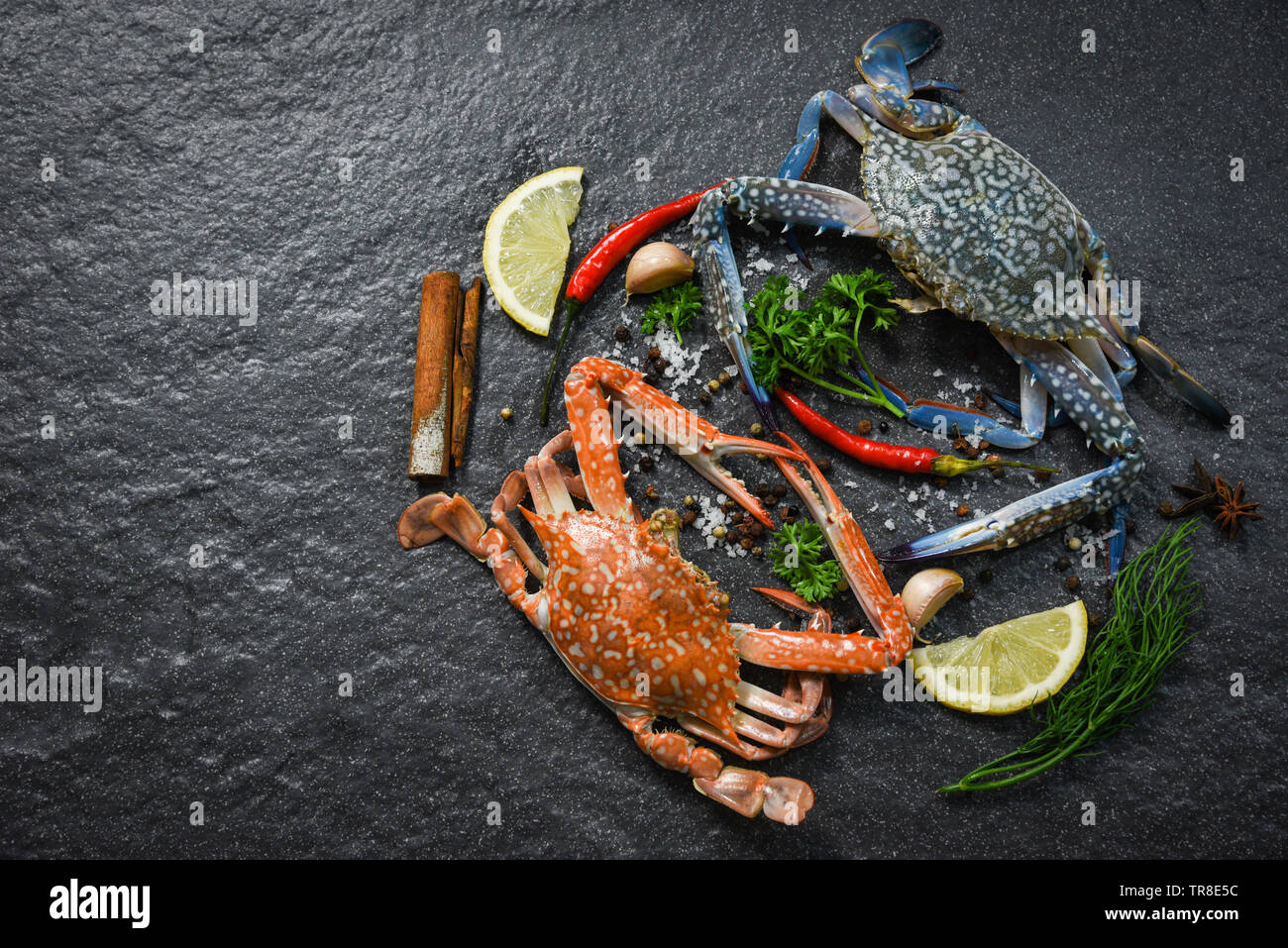 Fresh raw Crab cooked shellfish seafood and Steamed crab with herbs and ...