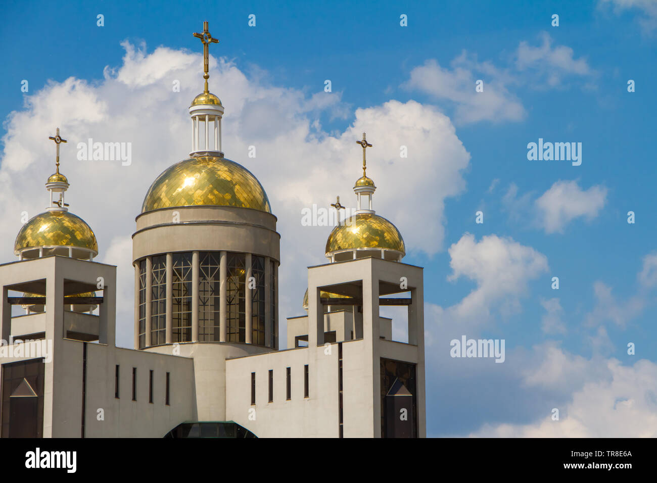 Close-up of the upper part of the modern five-headed church against the ...