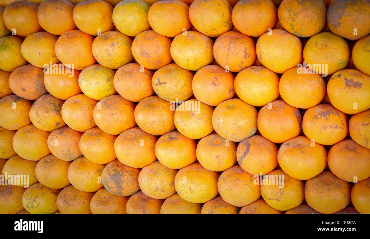 Fresh orange fruit texture background for sale in the market - Asia ...