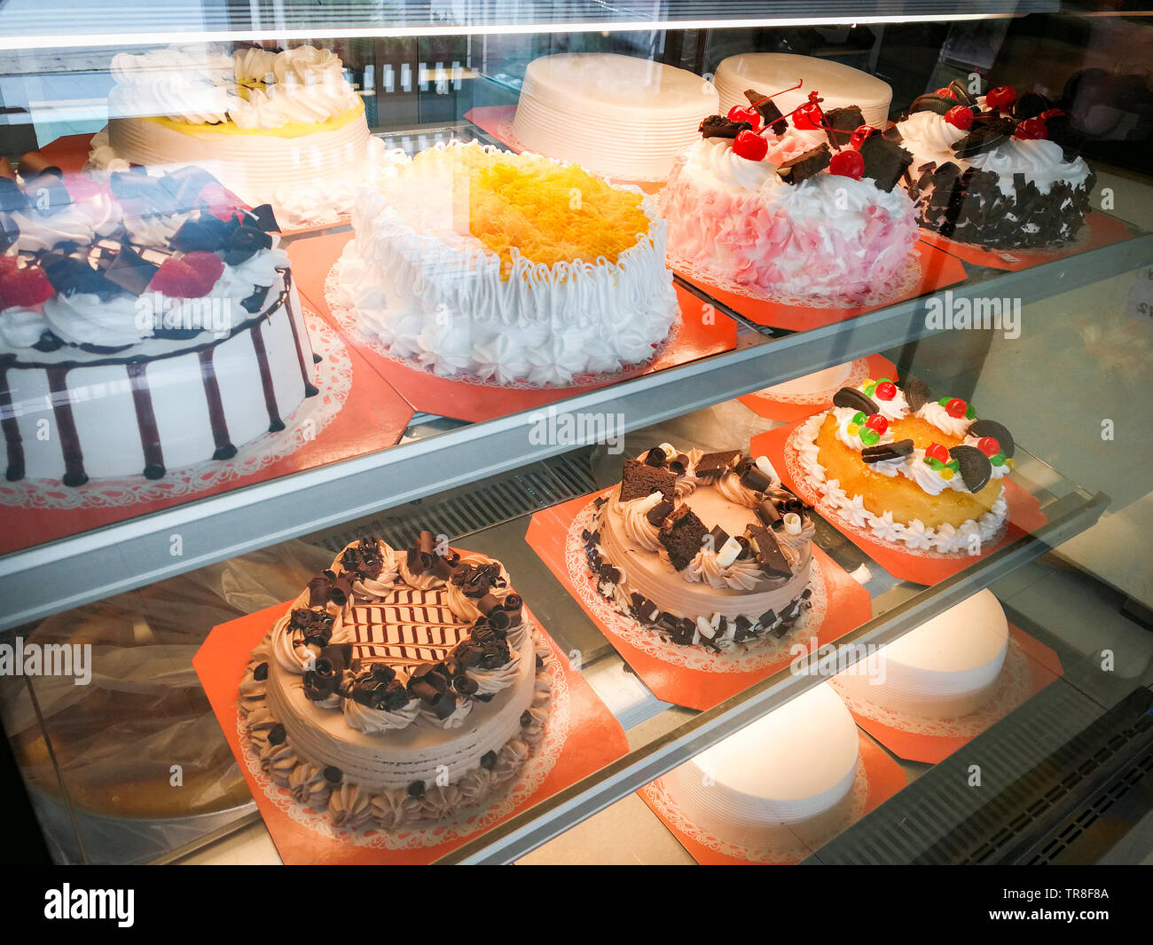 Cake tray in showcase glass display at store bakery pastry shop Stock ...