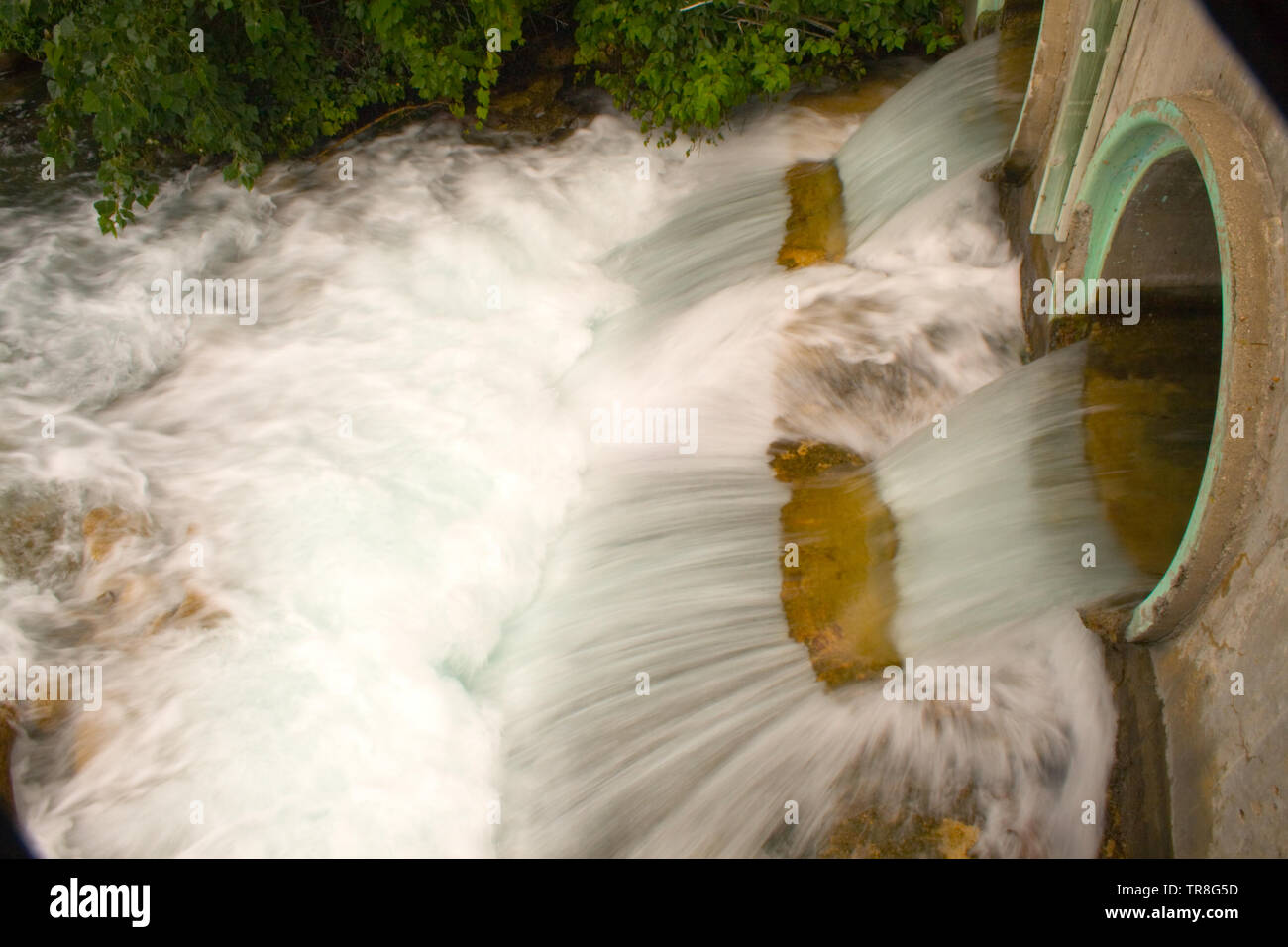 Culvert with Rushing Water, Elk Rapids, Michigan Stock Photo - Alamy