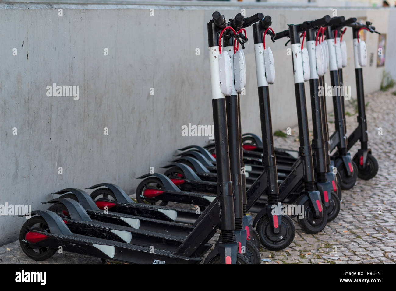 Electric scooters in a row Stock Photo - Alamy