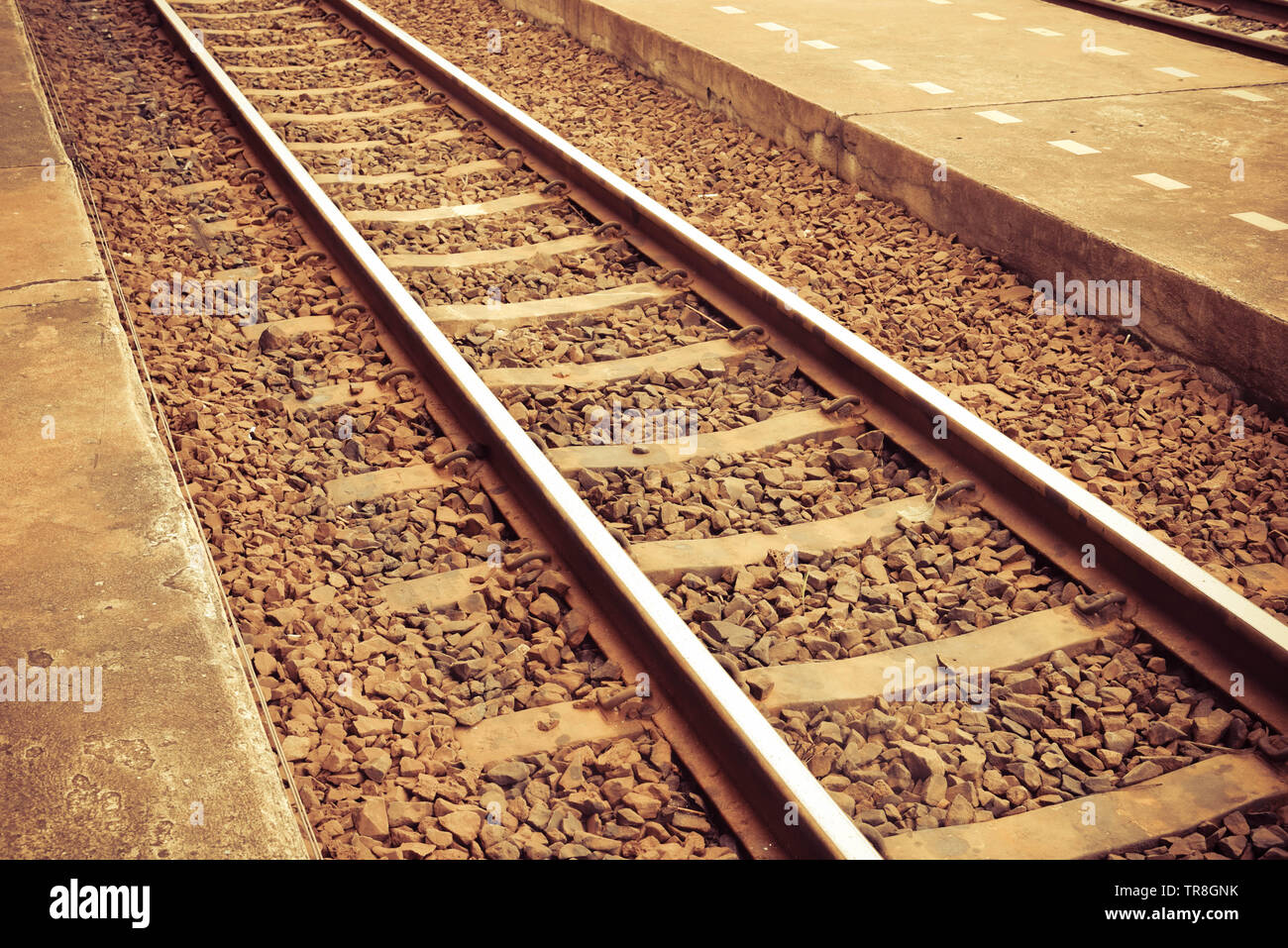 railroad tracks train leading from train station railway in countryside ...