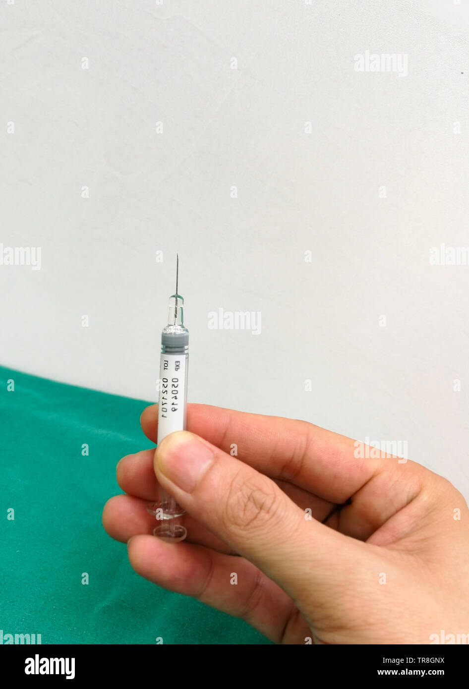 Medical syringe injection needle in hand / Equipment medical tool for ...