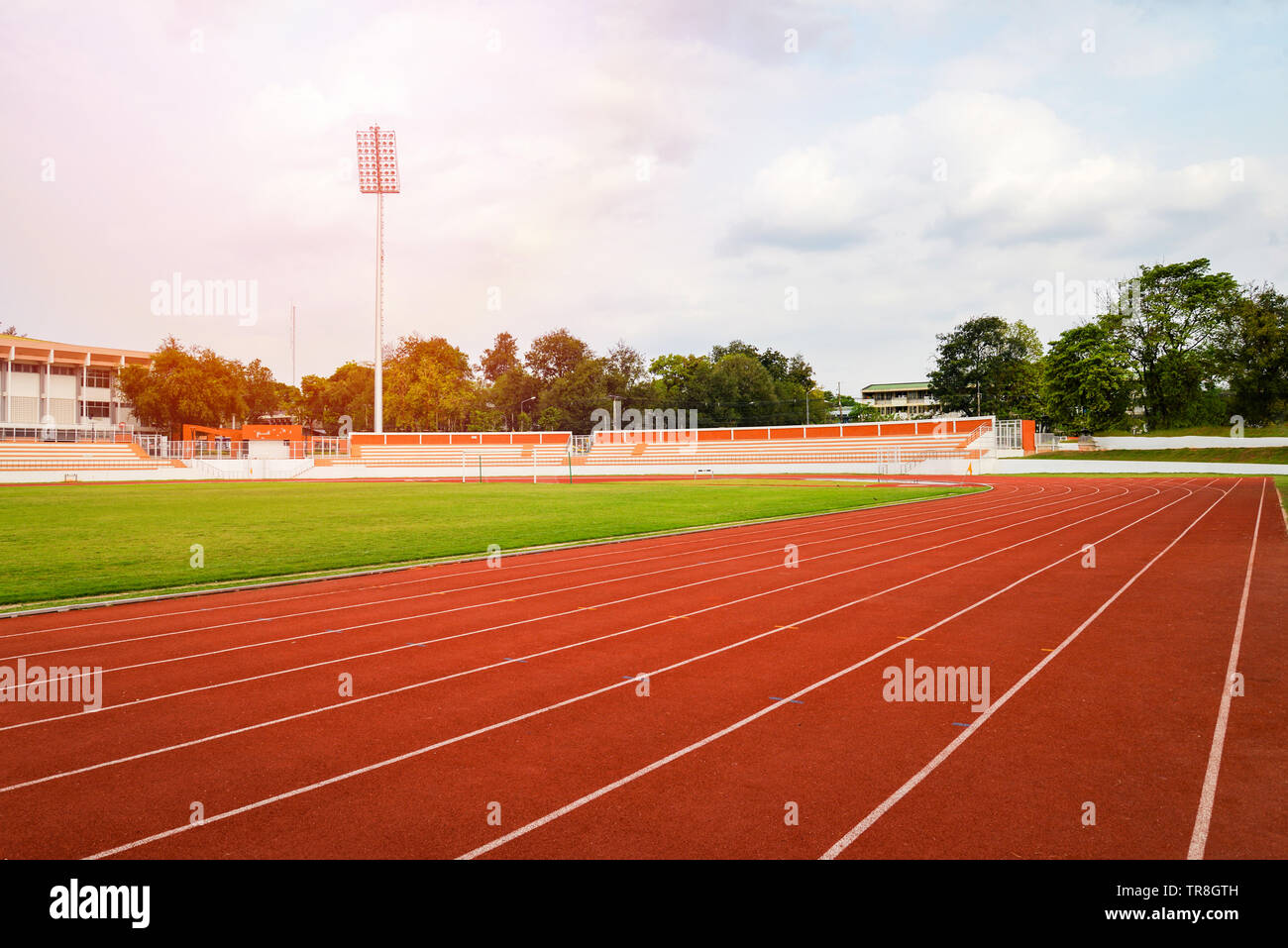 Athletics Track Run / Red running track in stadium with green field ...