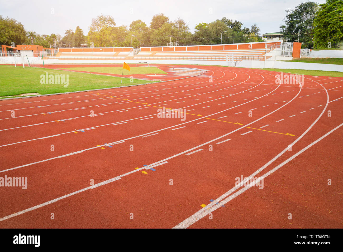 Athletics Track Run / Red running track in stadium with green field ...