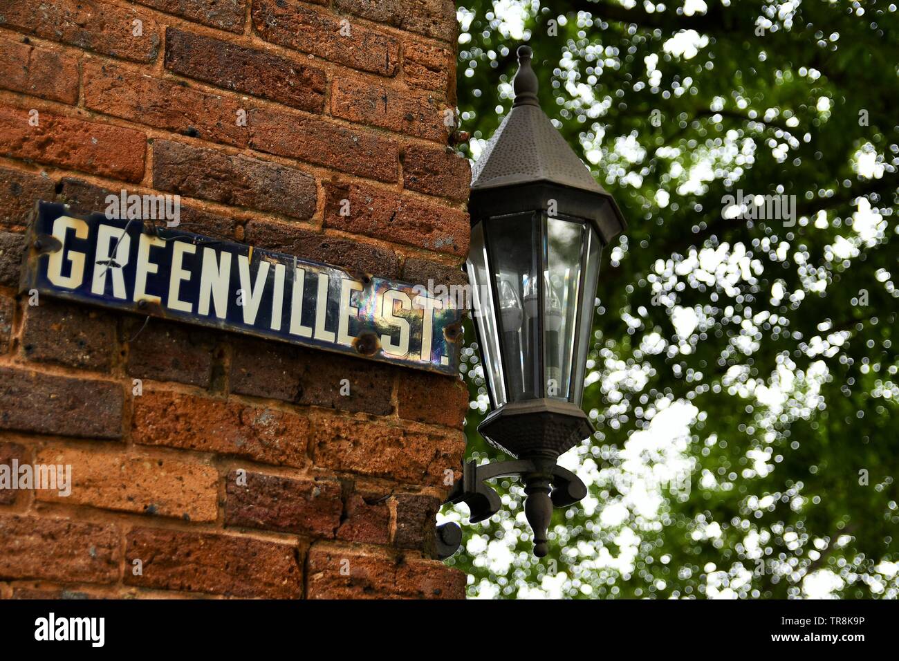 Urban setting, Greenville Street sign on the side of a brick building ...