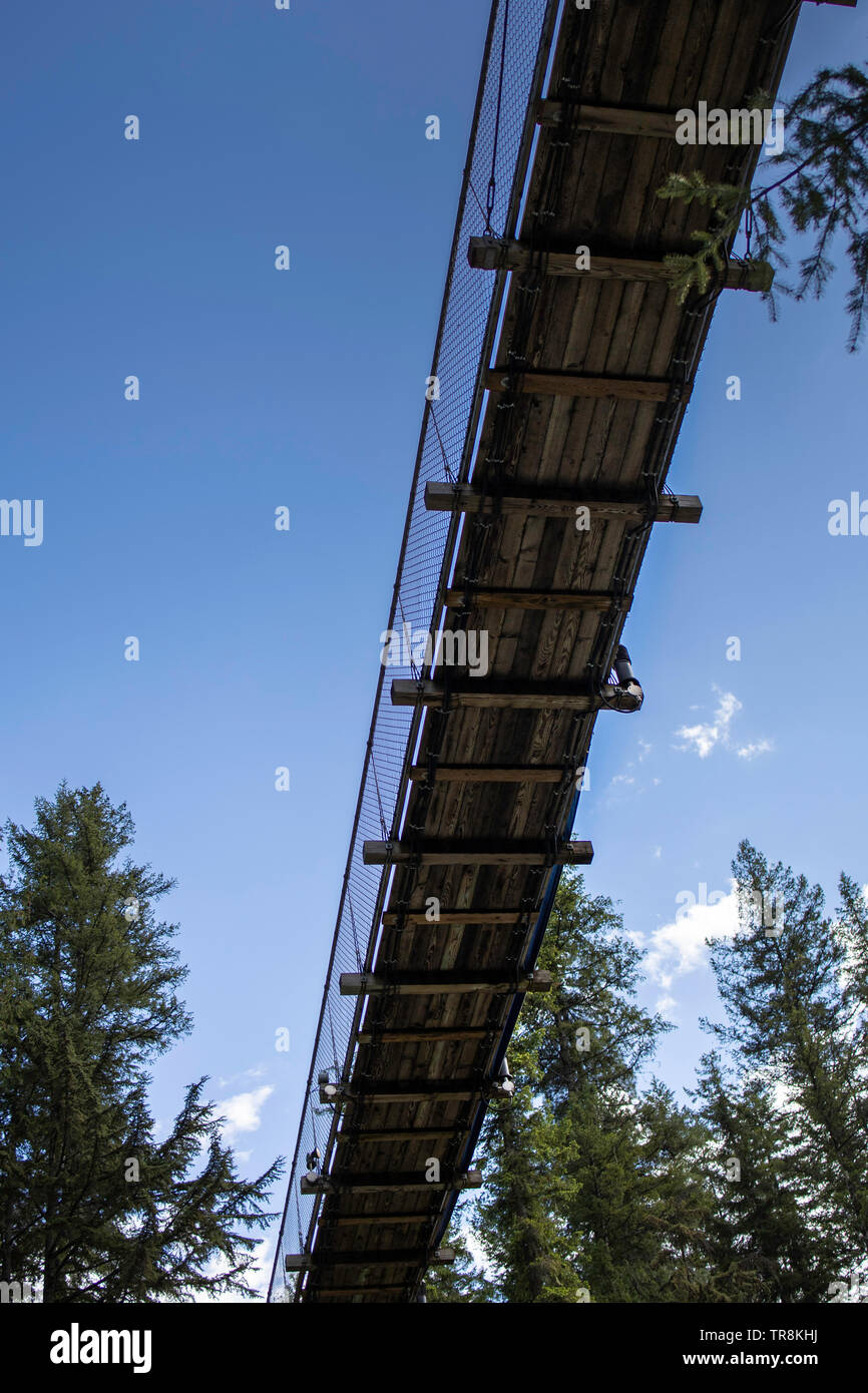 Suspension bridge high above leading across Stock Photo - Alamy